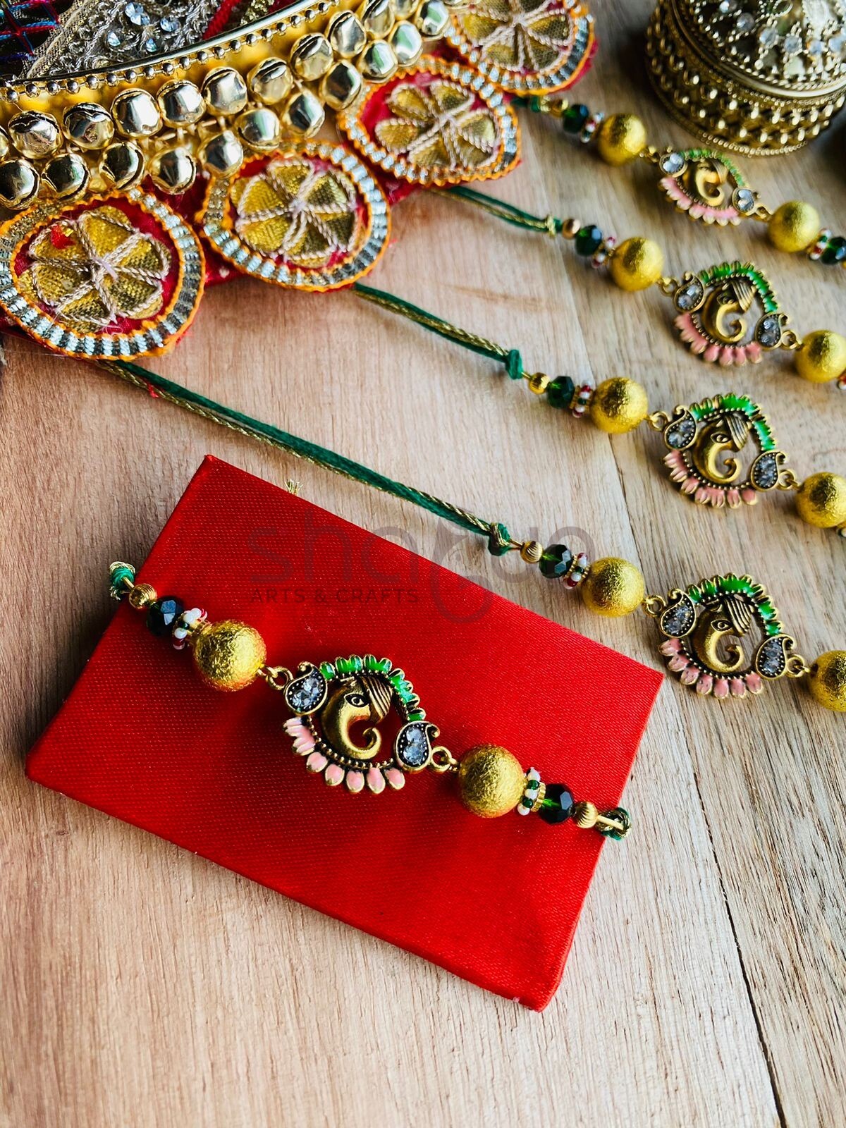 Ganesha with Gold Bead Rakhi - Shagun Arts and Crafts